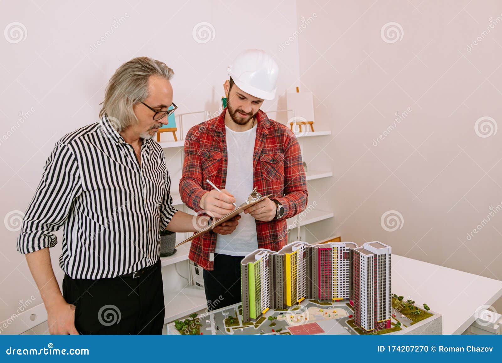 Professional Architect and Young Student Builder in Office Stock Photo ...