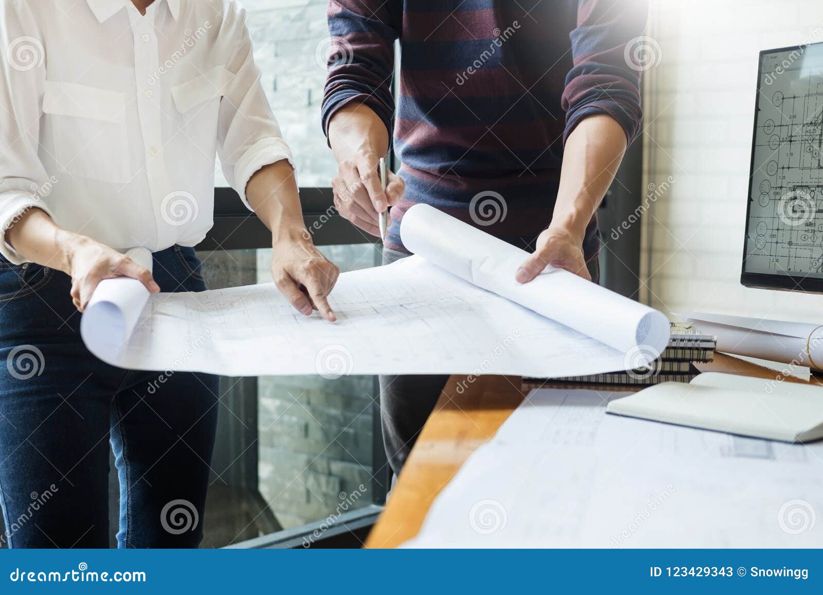 Professional Architects Working on Blueprint Discussing Construction ...