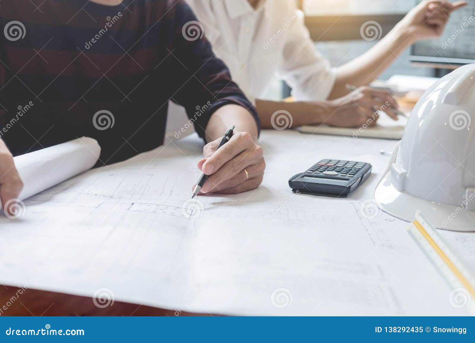 Professional Architects Working on Blueprint Discussing Construction ...