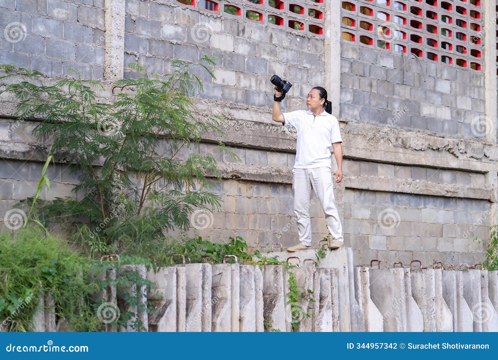 Professional Asian Chinese - Thai Camera Man Posture and Focus in ...