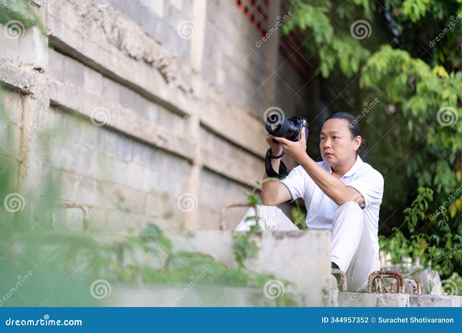 Professional Asian Chinese - Thai Camera Man Posture and Focus in ...