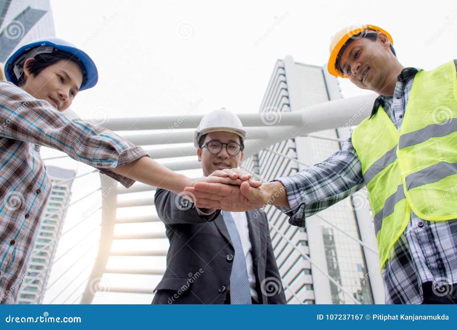 Professional Asian Engineering Team Joining Hands Together from Lower ...