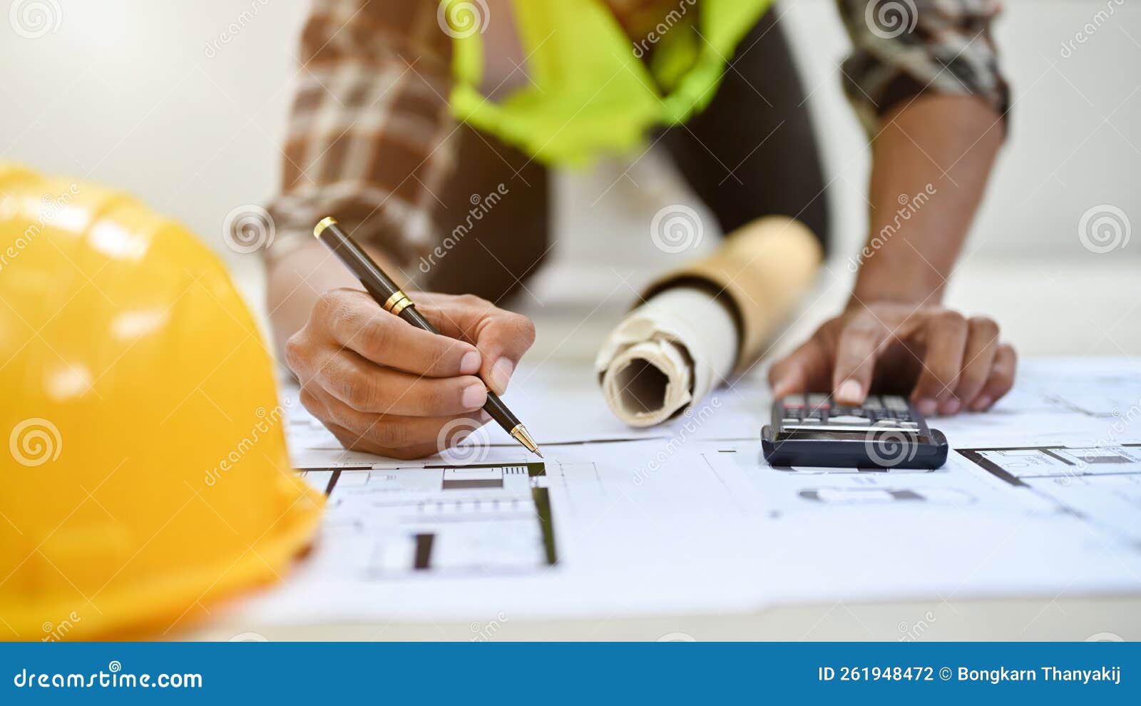 Professional Asian Male Engineer or Construction Engineer Writing ...
