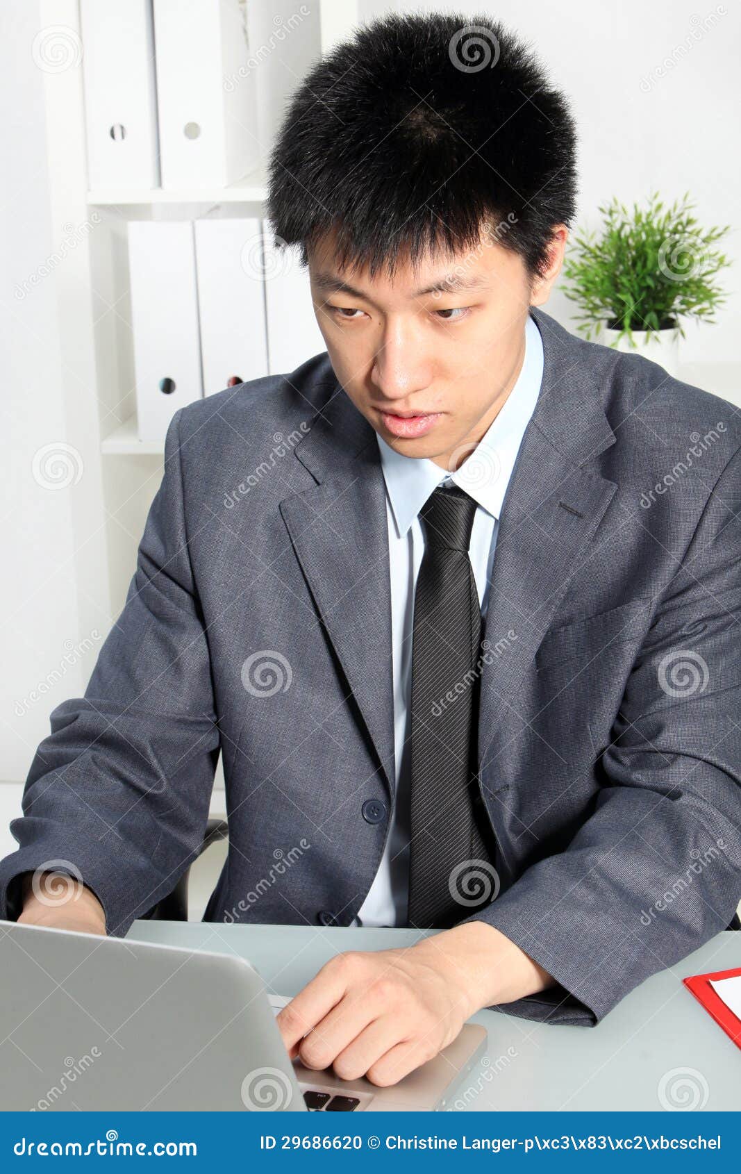 Professional Asian Man Focusing at His Desk Stock Photo - Image of desk ...