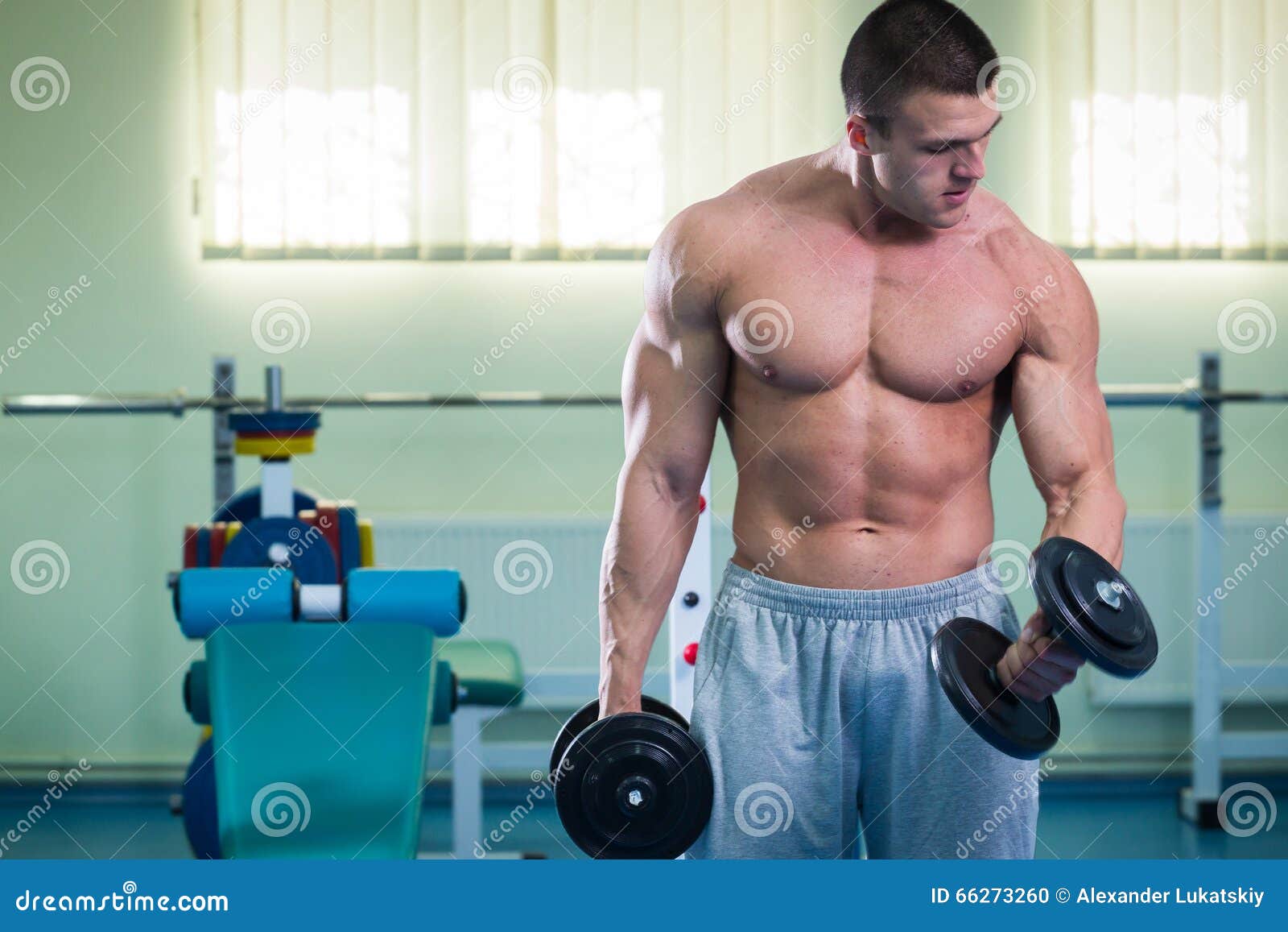 Professional Athlete Performs Exercises in the Gym Stock Photo - Image ...