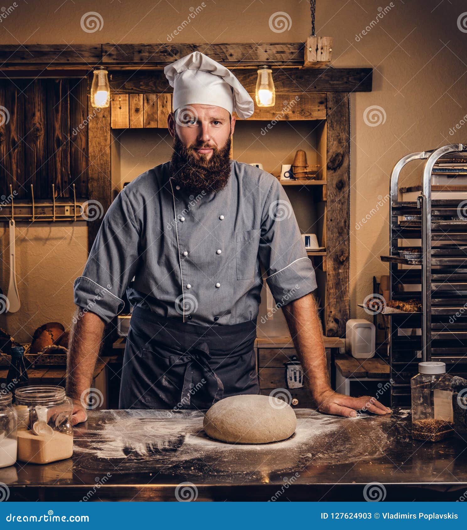 Professional Baker in Cook Uniform Leaning on Table in the Bakery and ...