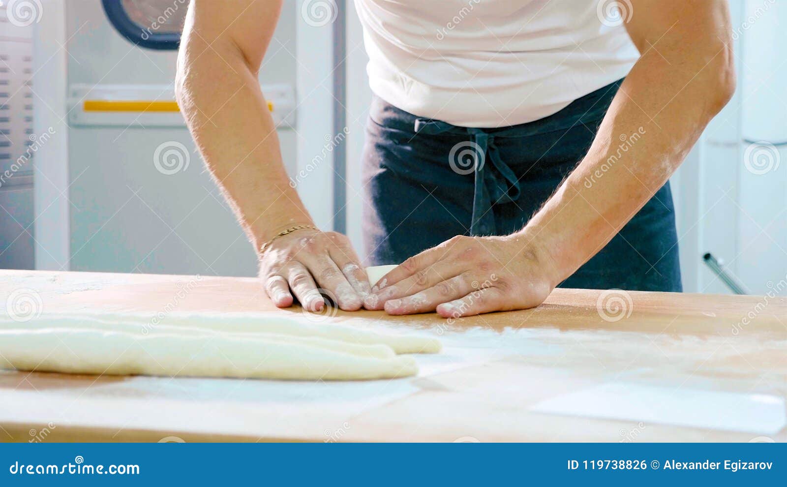 Professional Baker is Forming Pieces of Dough in Bakery Commercial ...