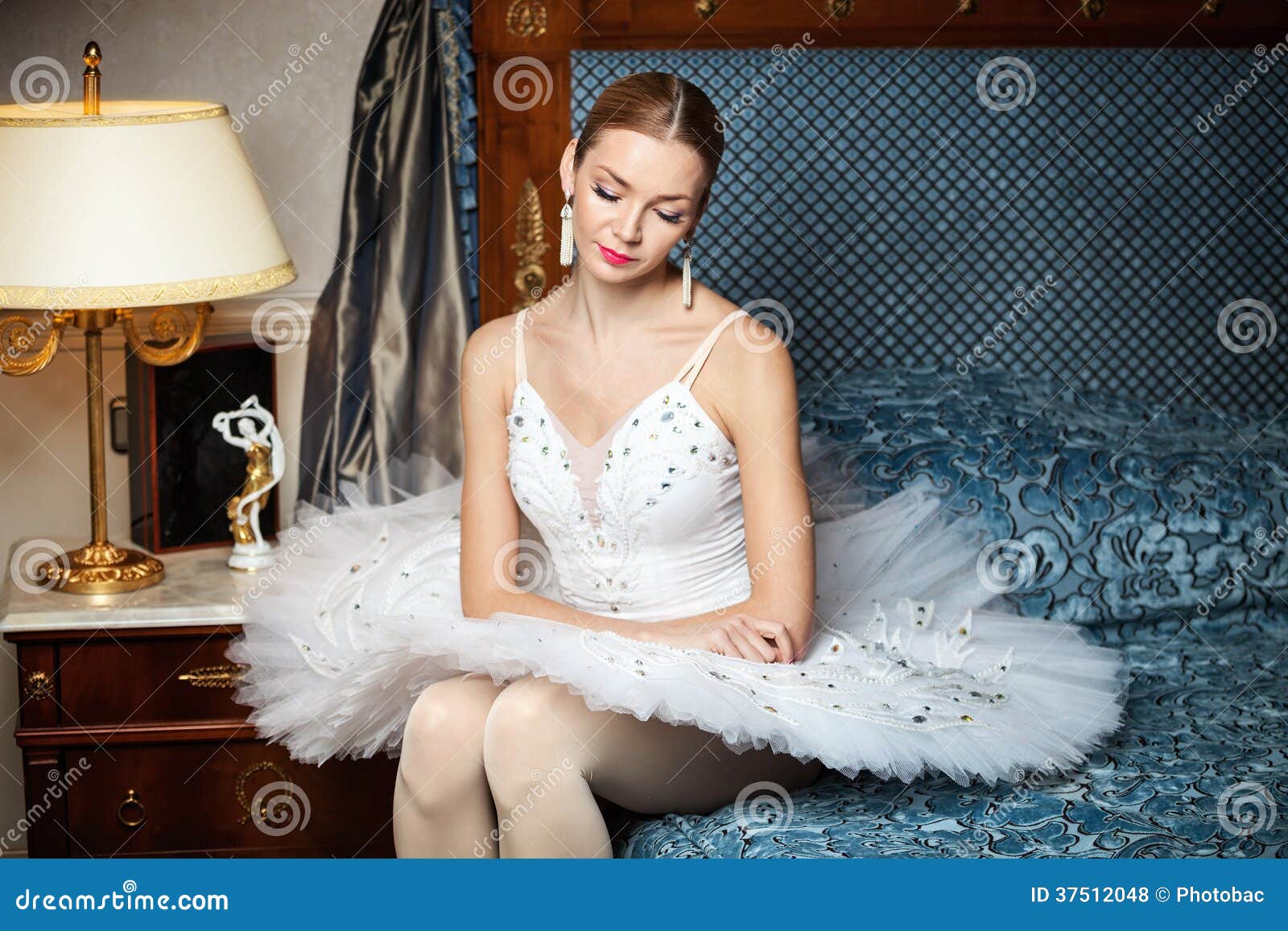 Professional Ballet Dancer Sitting on Sofa Stock Photo - Image of dress ...