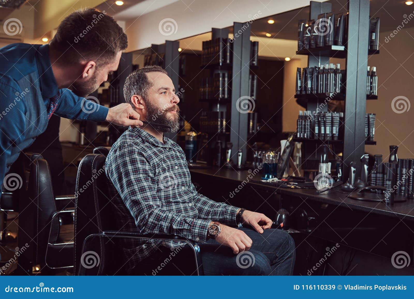 Professional Barber Working with a Client in a Hairdressing Salon ...