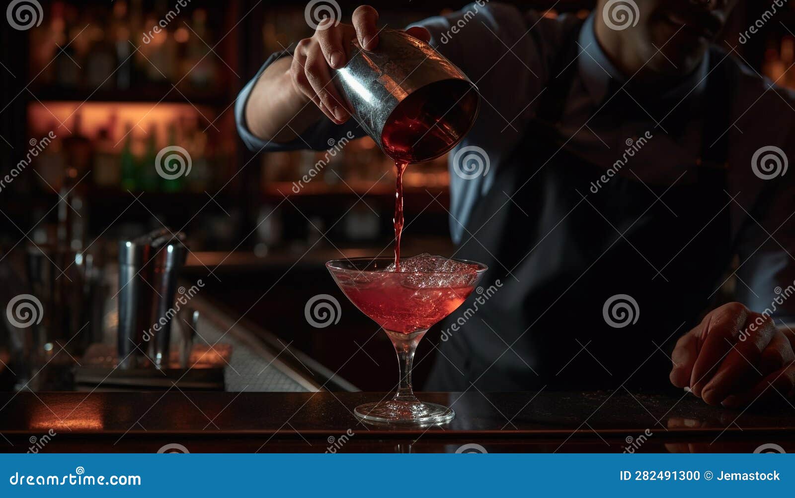 Professional Bartender Mixing Fresh Cocktails at the Bar Counter ...