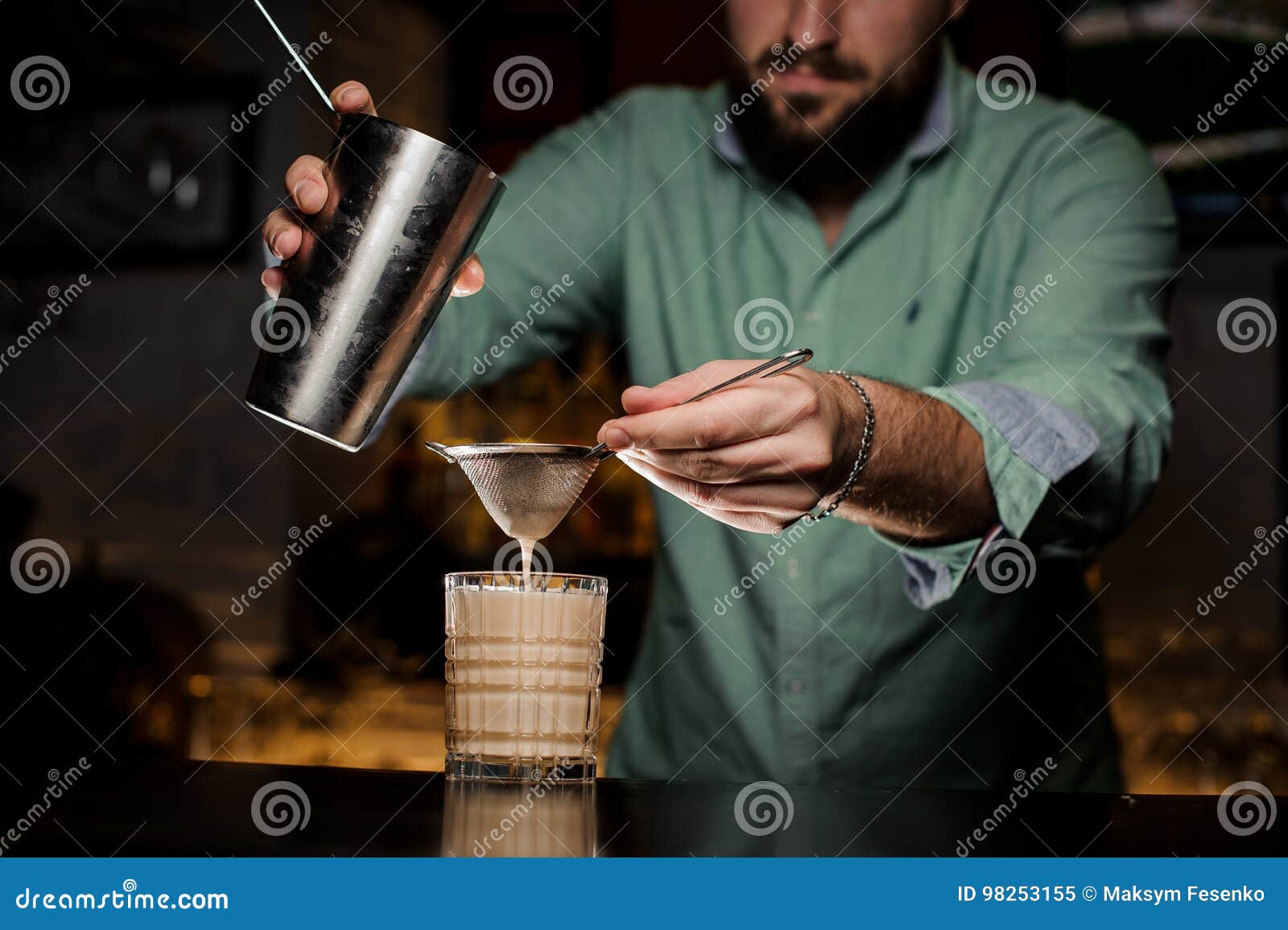 Professional Bartender Pours Alcohol from the Shaker Stock Image ...