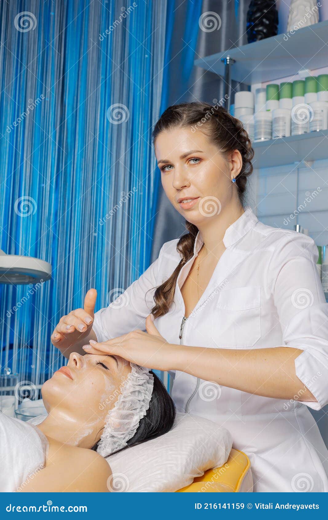 Professional Beautician Makes A Facial Massage To A Woman Stock Image