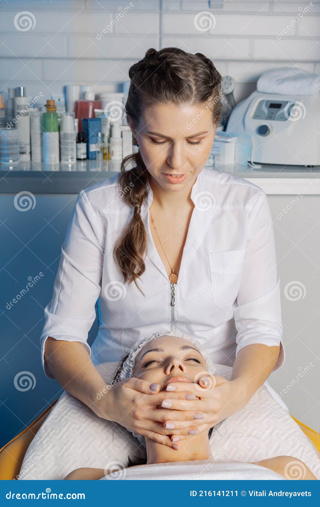 Professional Beautician Makes A Facial Massage To A Woman Stock Image