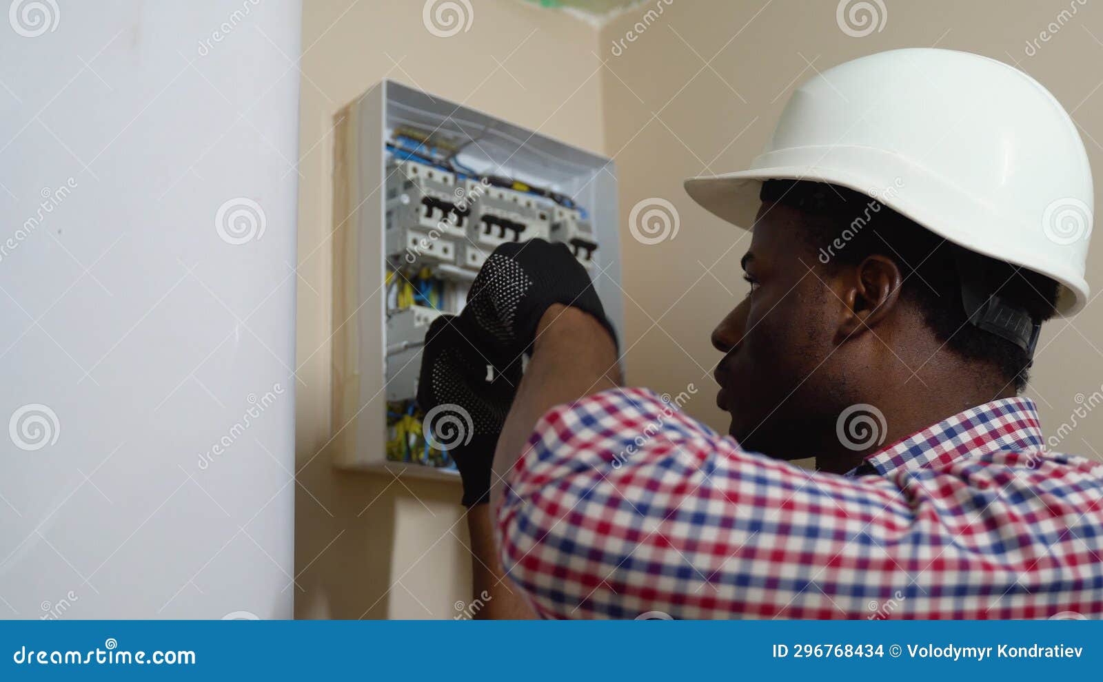 Professional Black Electrician Installing Electrical Panel Stock ...