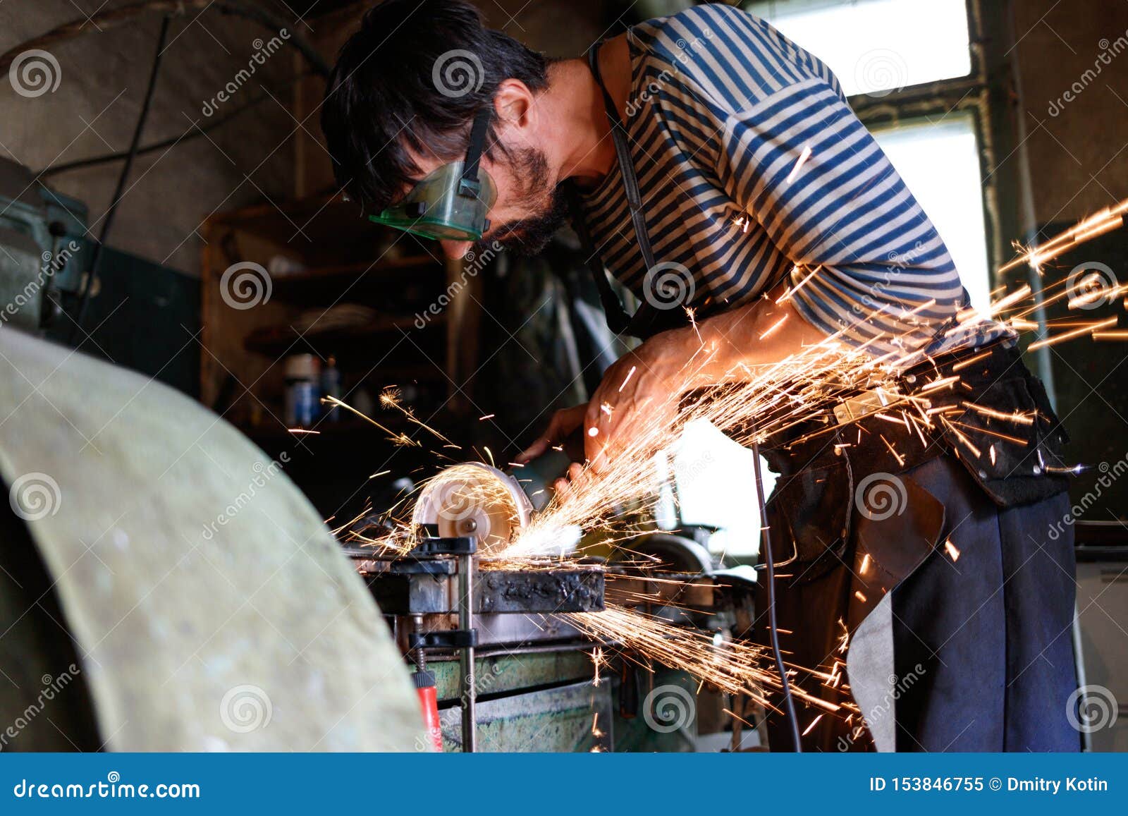 Professional Blacksmith Sawing Metal with Hand Circular Saw at Forge ...