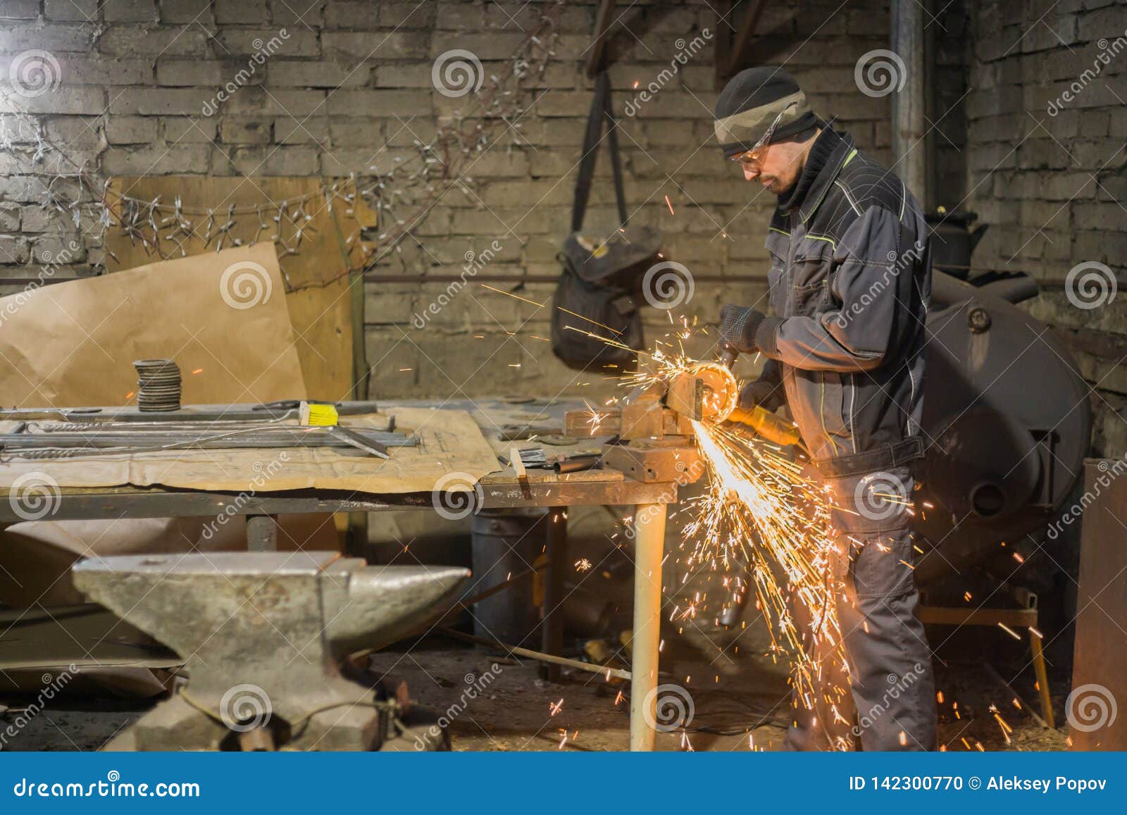 Blacksmith Sawing Metal with Hand Circular Saw Stock Photo - Image of ...