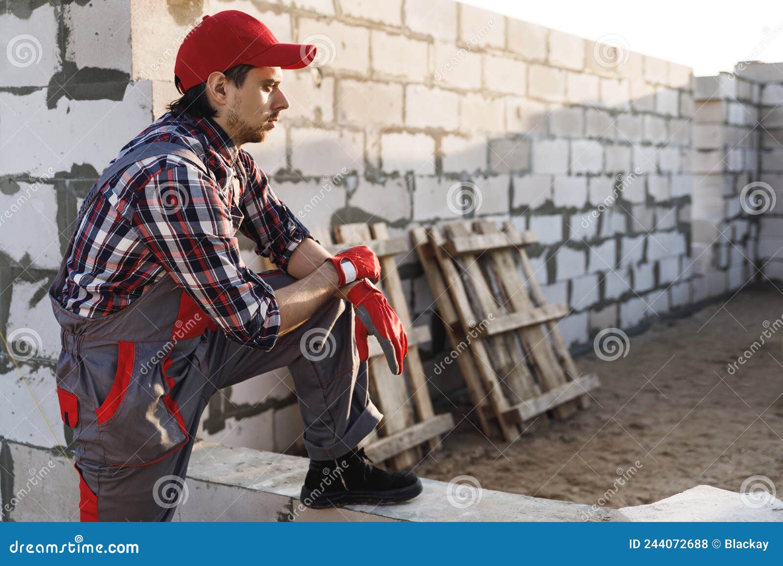 Professional Bricklayer Using Electric Saw Cutting Lightweight Brick ...