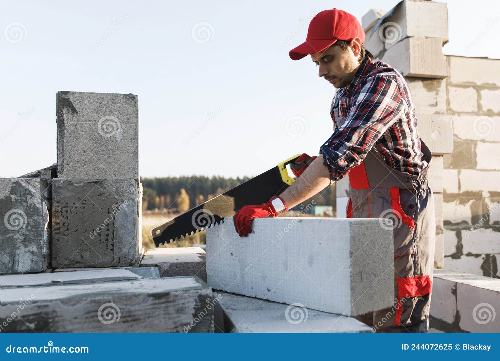 Bricklayer Man is Sawing Autoclaved Concrete Blocks Stock Image - Image ...
