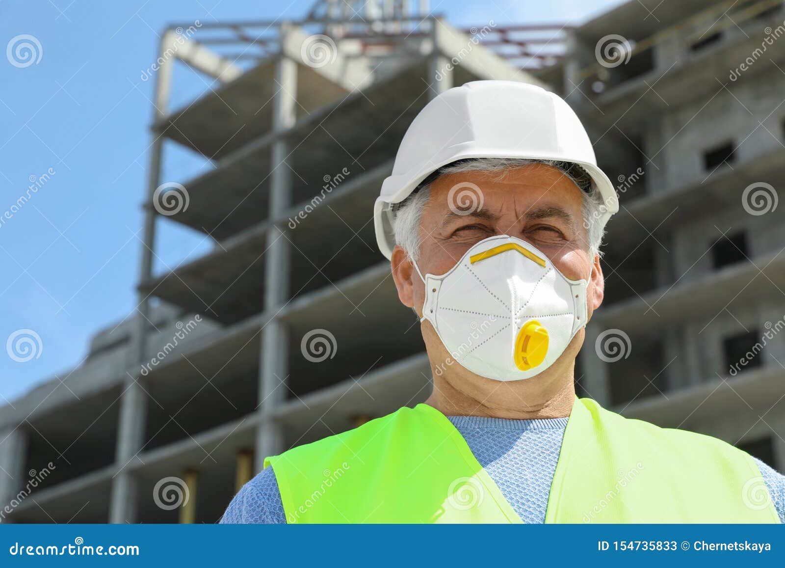 Professional Builder in Safety Equipment at Construction Site, Space ...