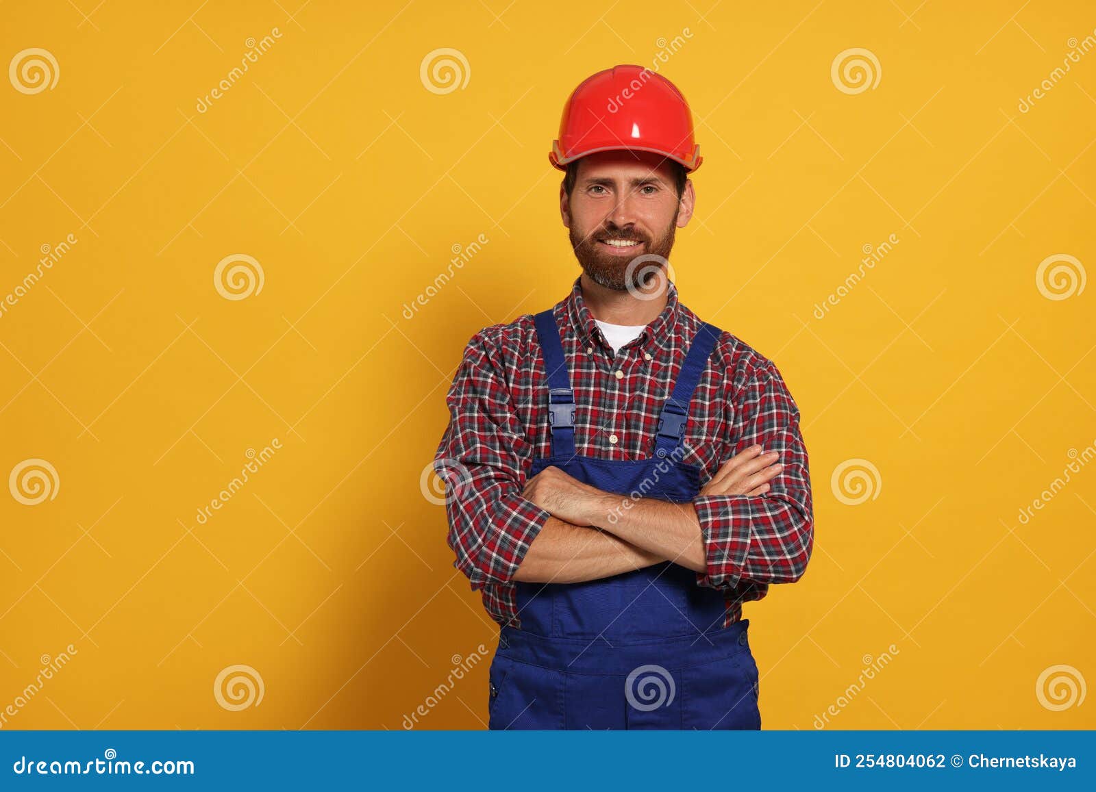 Professional Builder in Uniform on Yellow Background Stock Photo ...