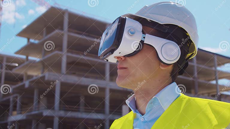 Professional Builder in VR Helmet Standing in Front of Construction ...