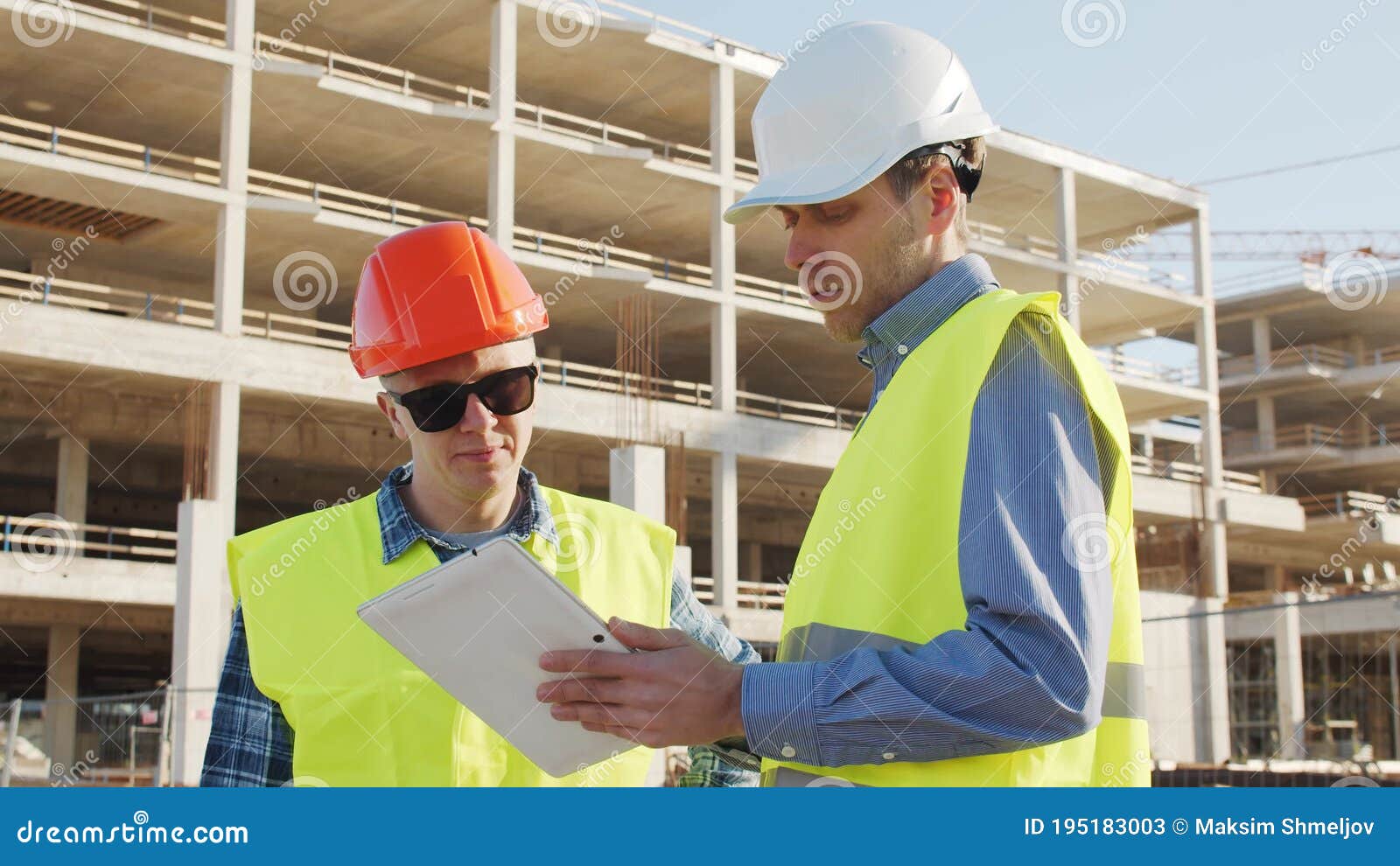 Professional Builders Standing in Front of Construction Site. Office ...