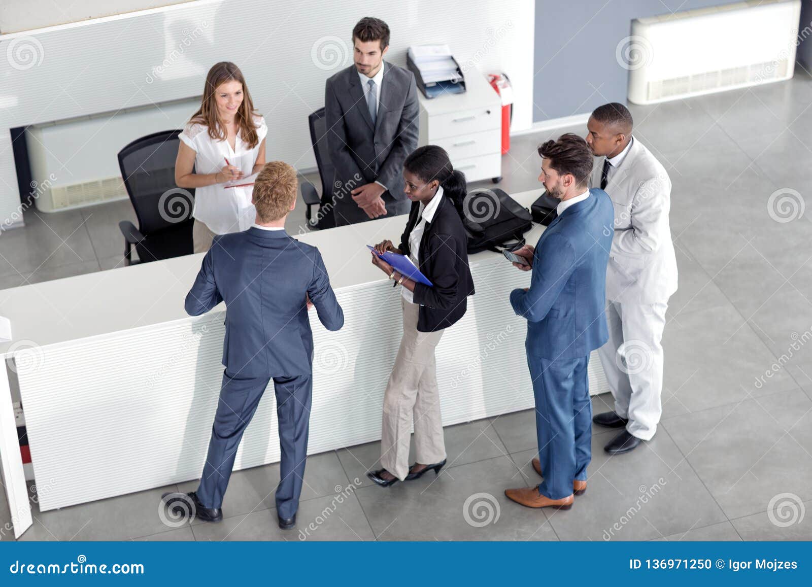 Professional Business People Checking at Reception Stock Photo - Image ...