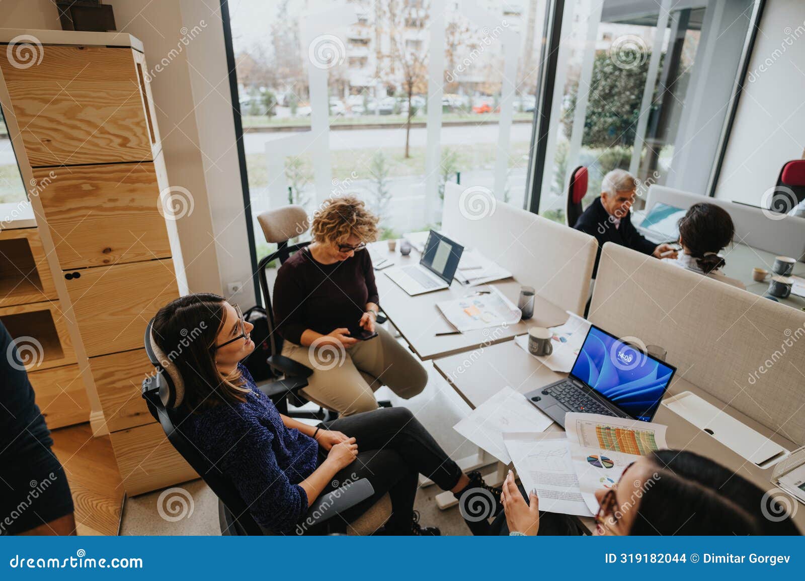 Diverse Group of Professionals Collaborating in a Bright, Contemporary ...