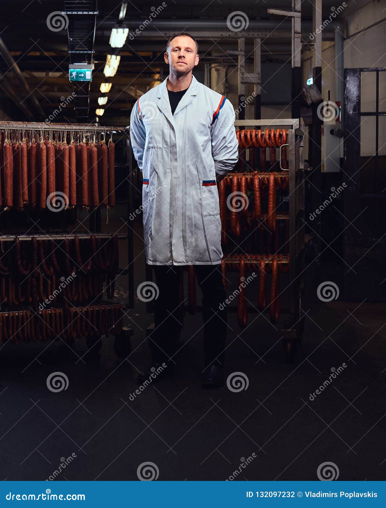 Professional Butcher Standing in the Storage Room. Stock Photo - Image ...