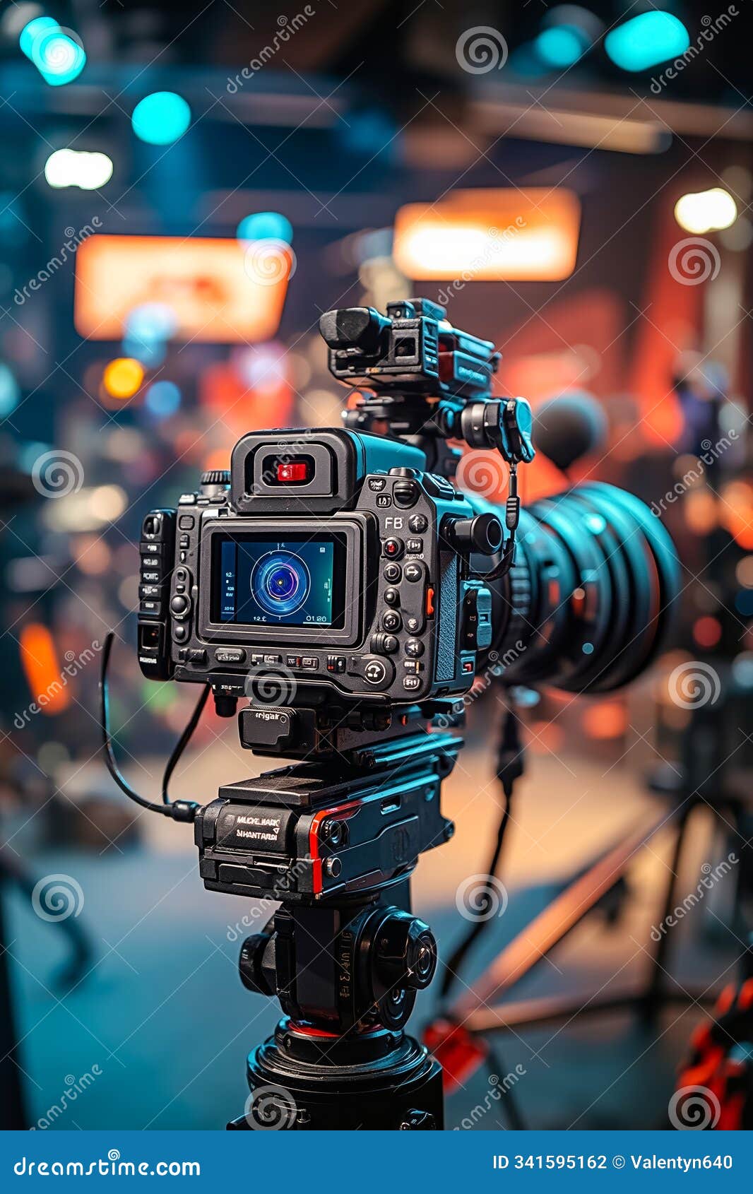 A Camera on a Tripod in Front of a Camera on Display Stock Photo ...