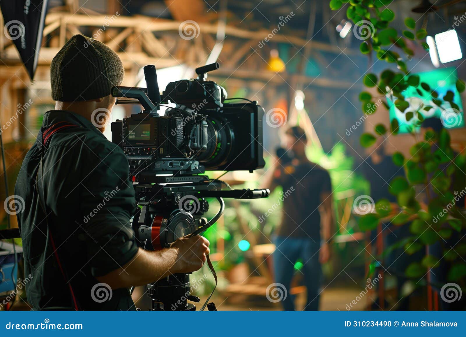 Professional Camera Operator Filming in a Studio Set Environment. Stock ...