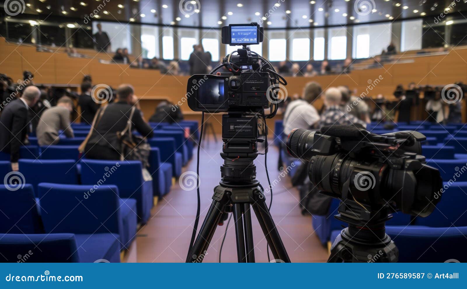 A Professional Camera on a Tripod Set Up in Front of a Press Conference ...