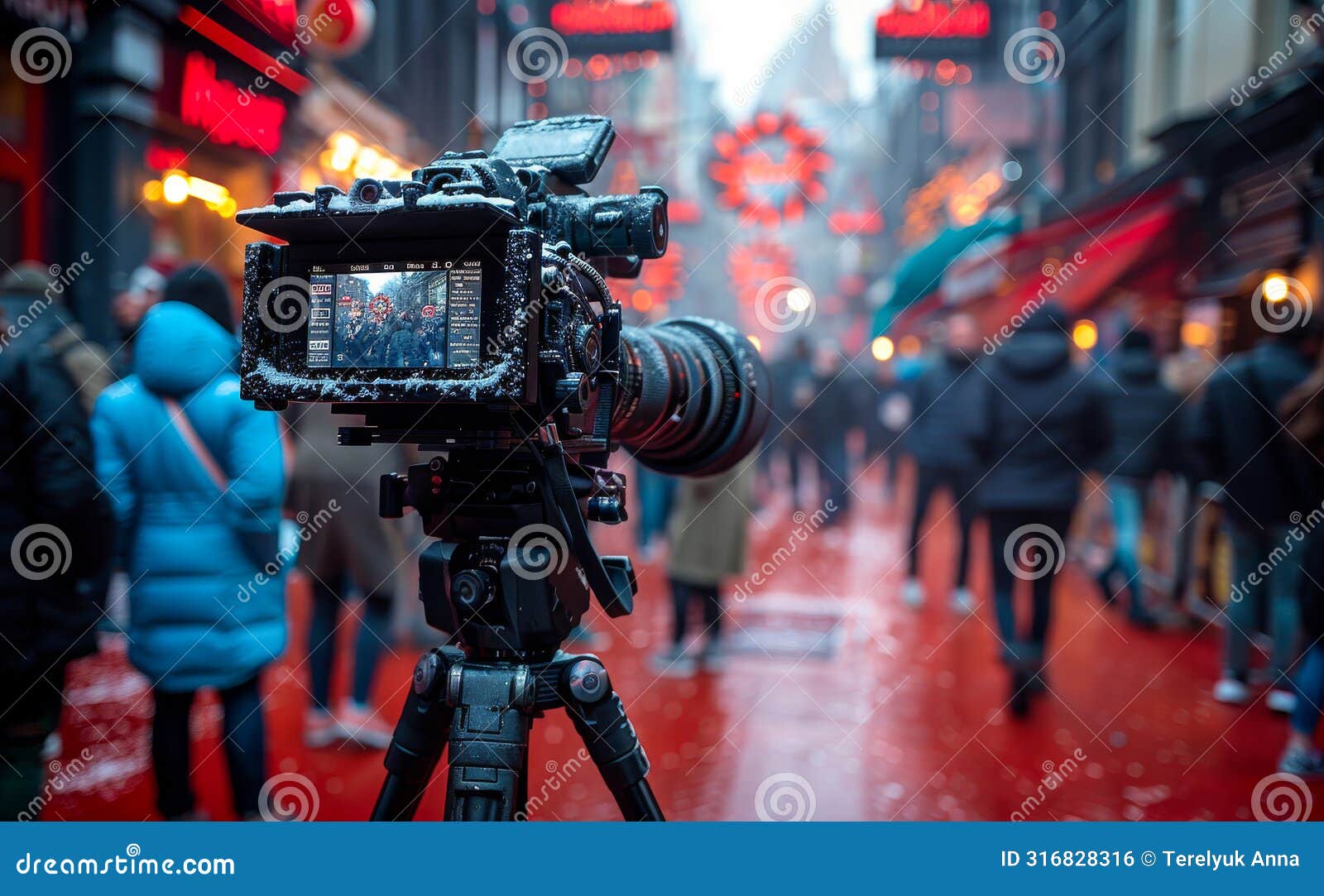 Professional Camera on Tripod Shooting Crowd on Rainy Street Stock ...