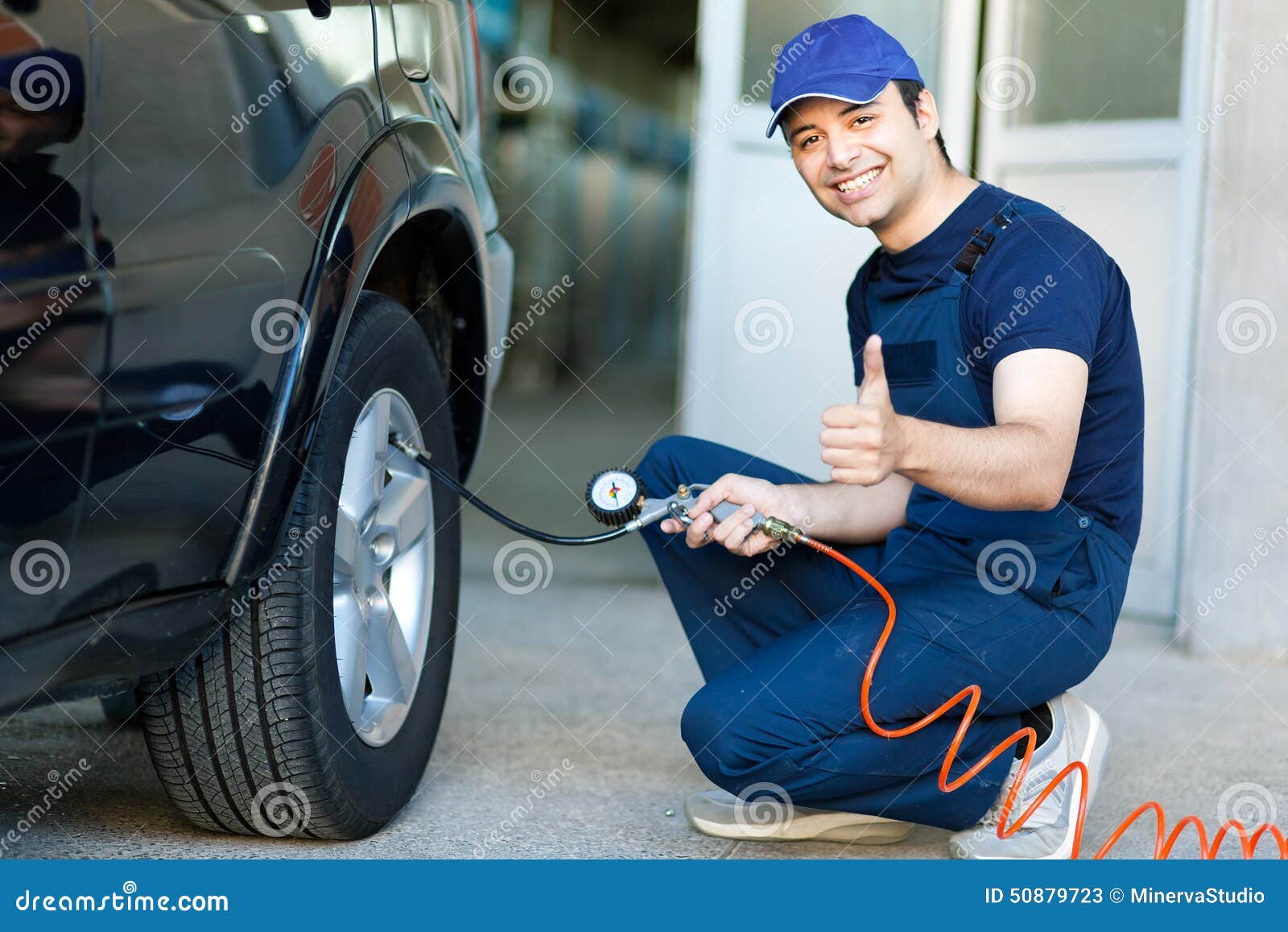 Professional Car Mechanic Working in Auto Repair Service. Stock Image ...