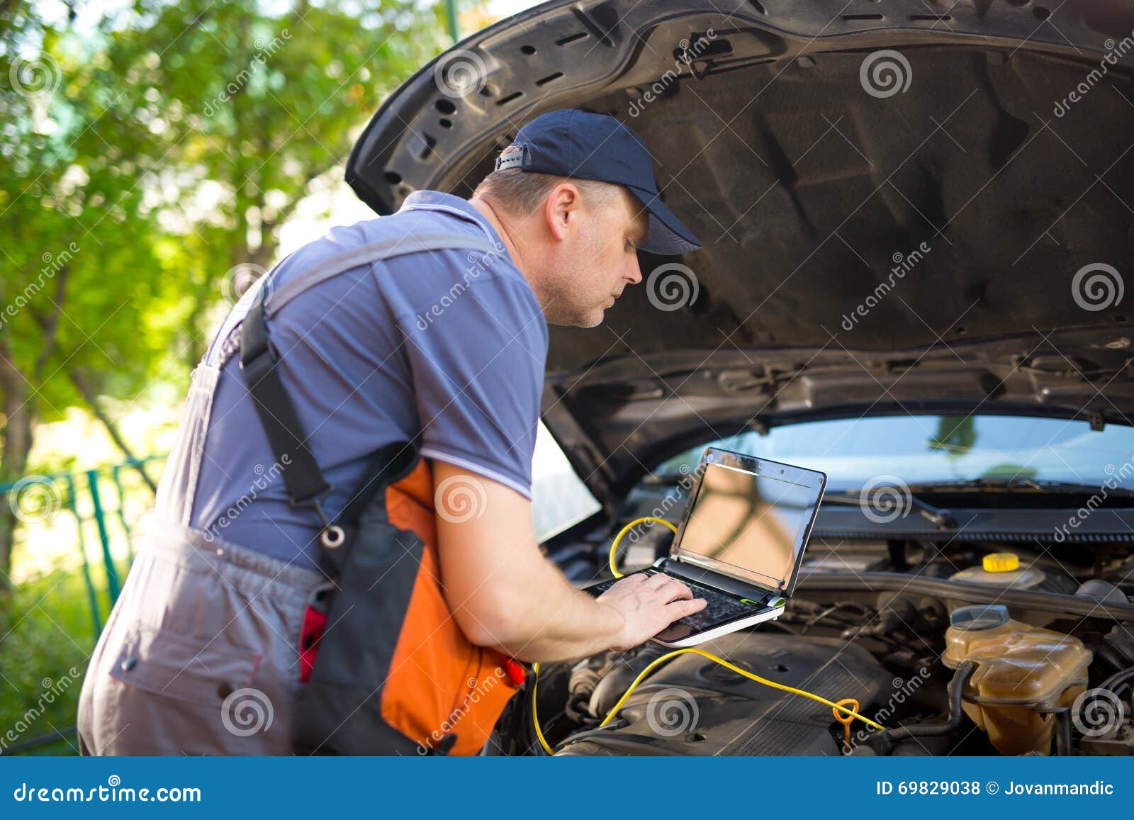 Professional Car Mechanic Working in Auto Repair Service, Using Stock ...