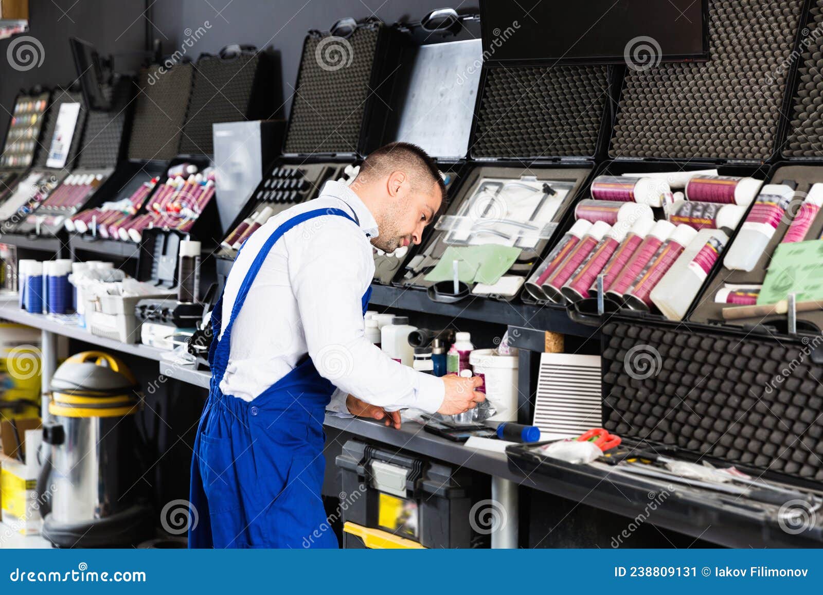 Professional Car Painter Preparing Paints for Paintwork in Modern Auto ...