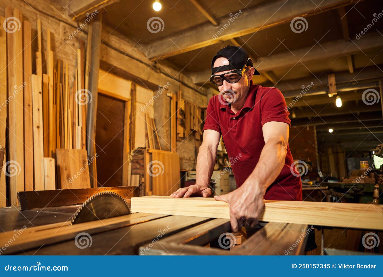 Professional Carpenter in Uniform Works on a Woodworking Machine at the ...