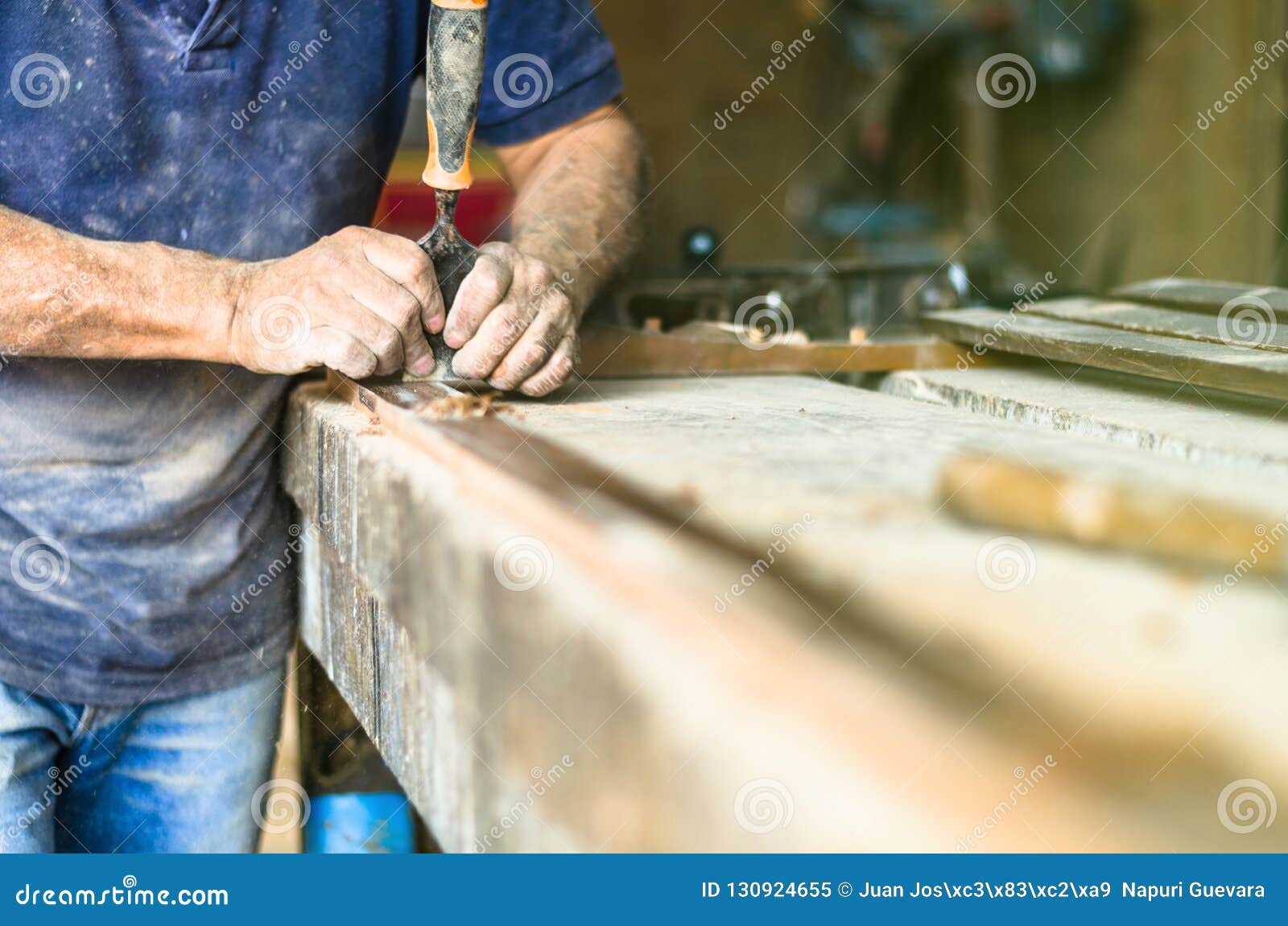 Professional Carpenter at Work, he is Carving Wood Using a Woodworking ...