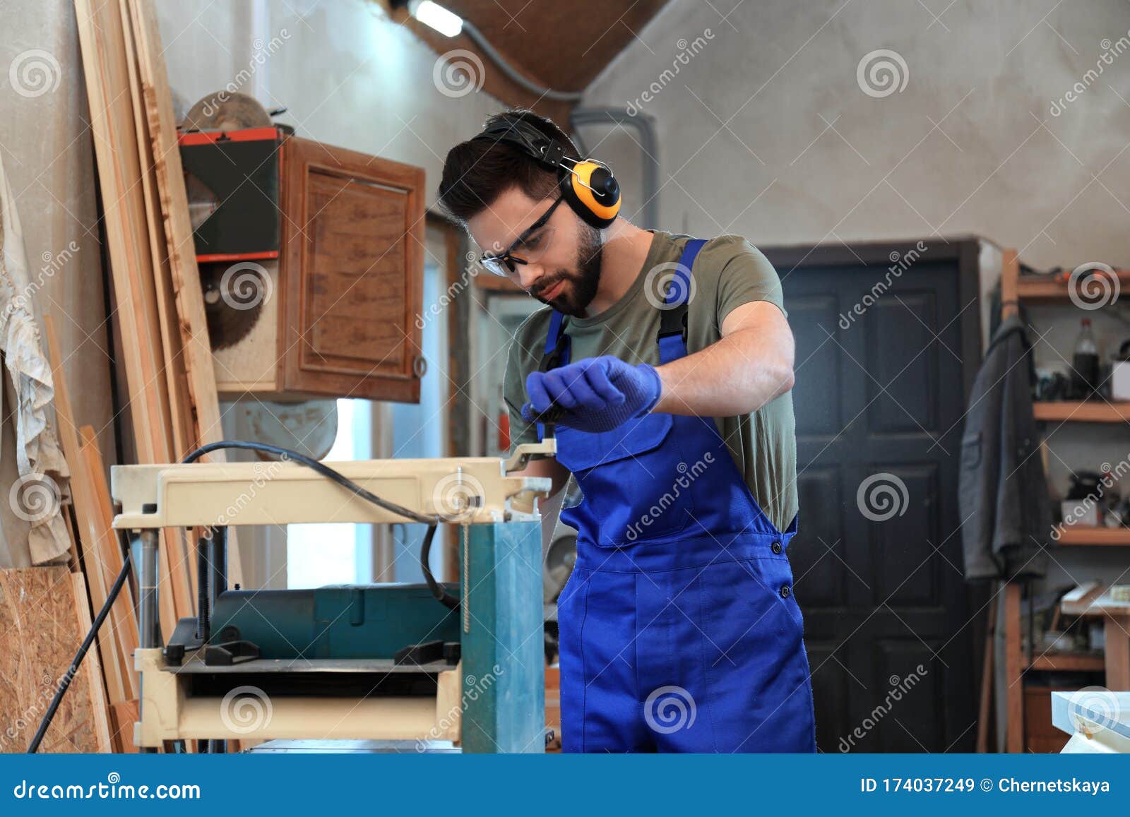Carpenter Working with Grinding Machine in Shop Stock Image - Image of ...