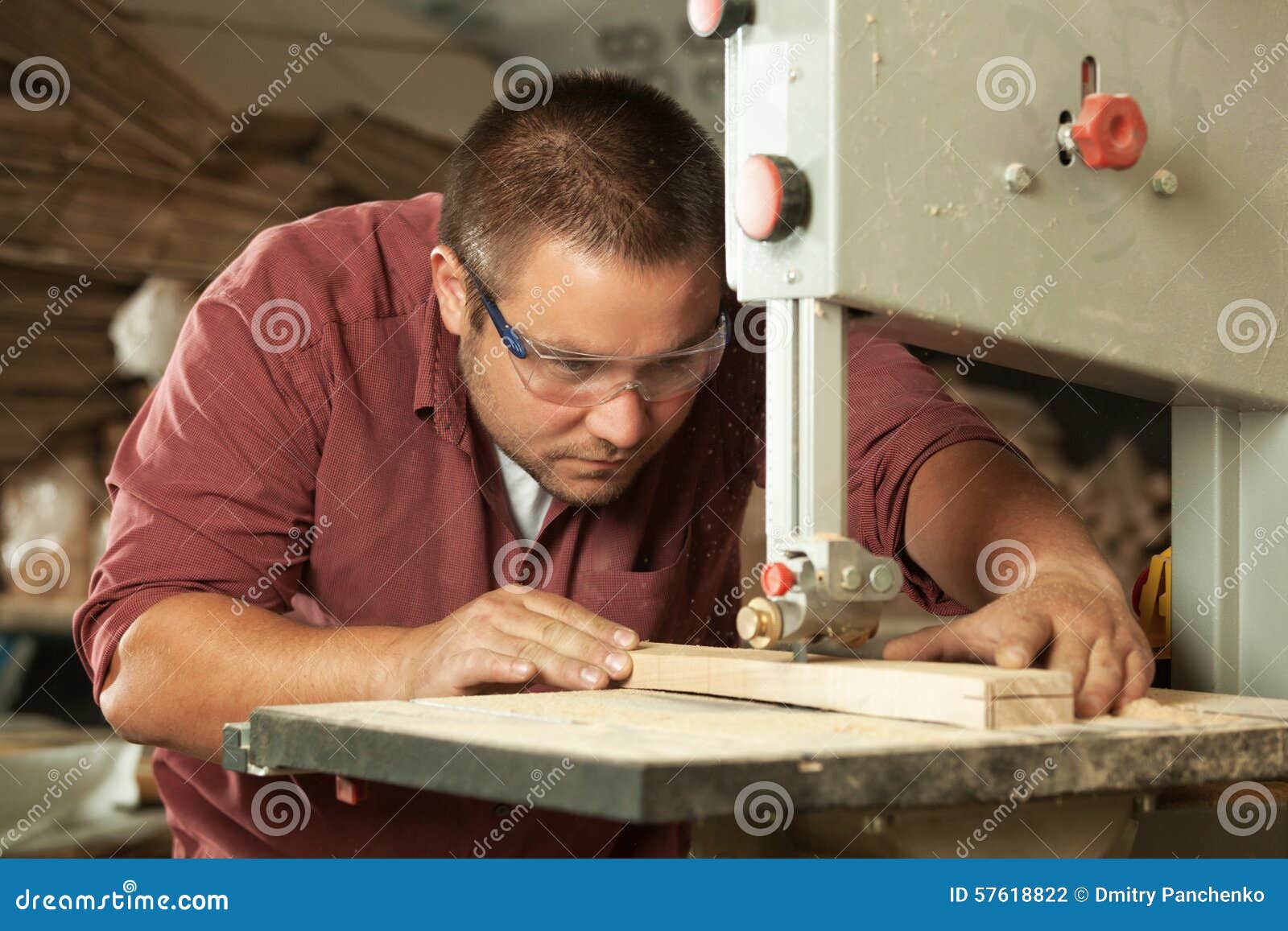 Professional Carpenter Working with Sawing Machine. Stock Photo - Image ...