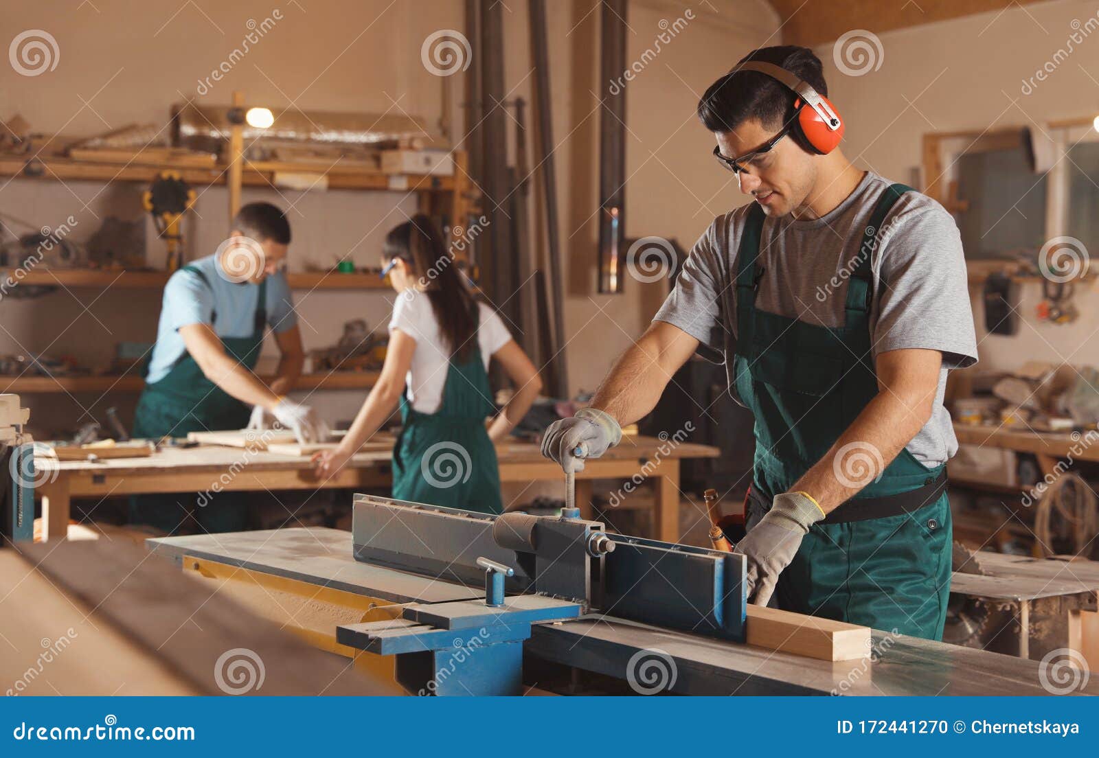 A Professional Carpenter Makes A Product From Wooden Boards And Slats ...