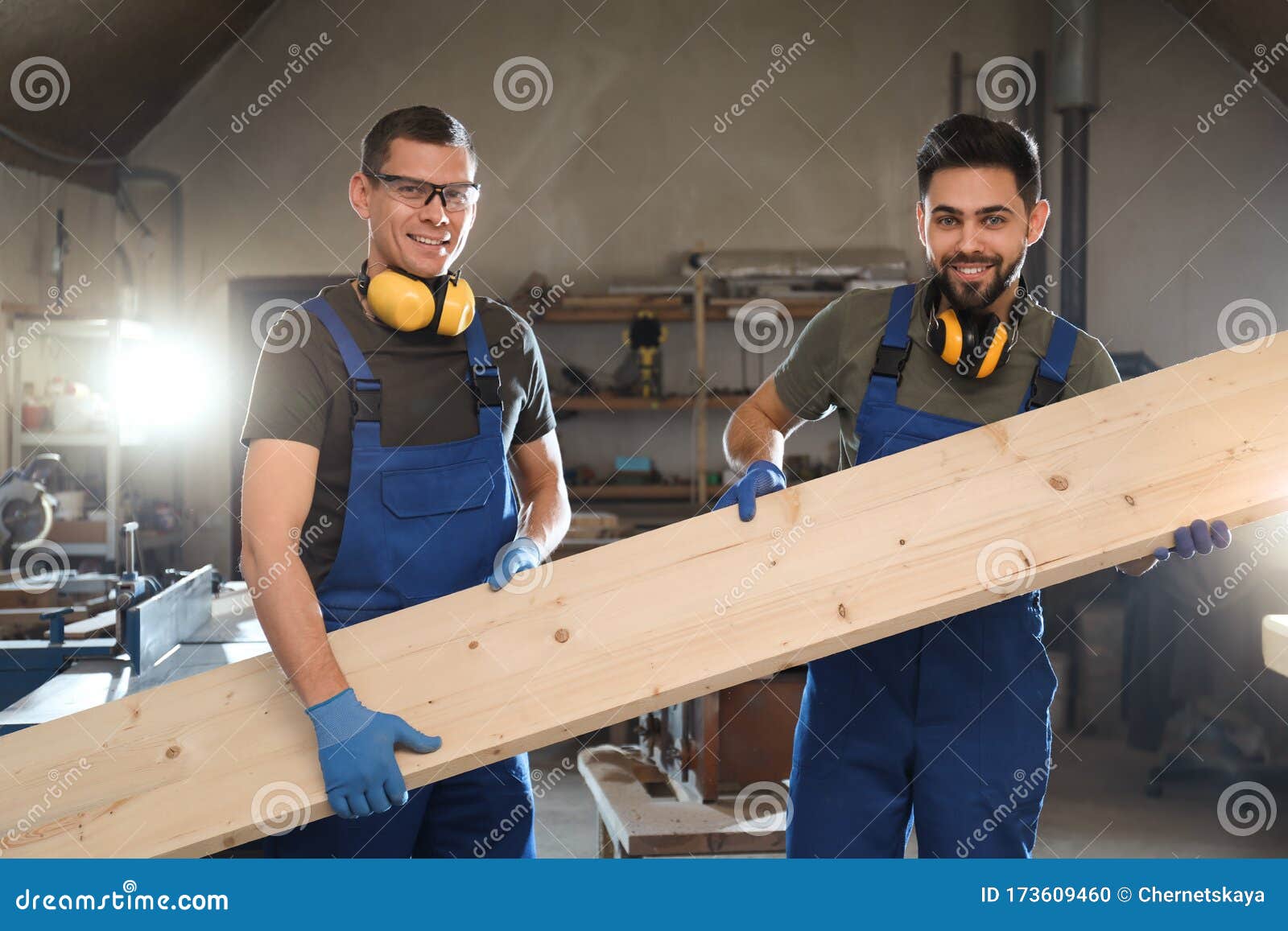 Professional Carpenters with Large Wooden Board in Workshop Stock Photo ...