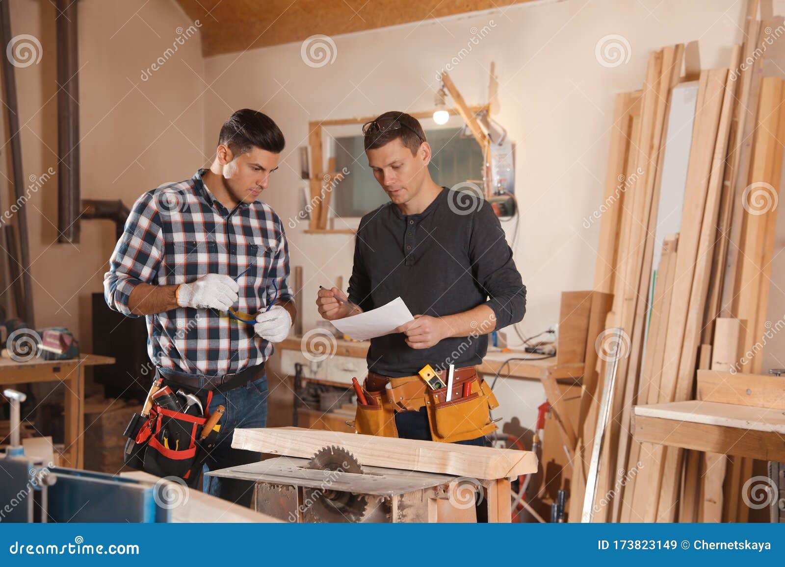 Carpenters Working with Draft in Workshop Stock Image - Image of people ...