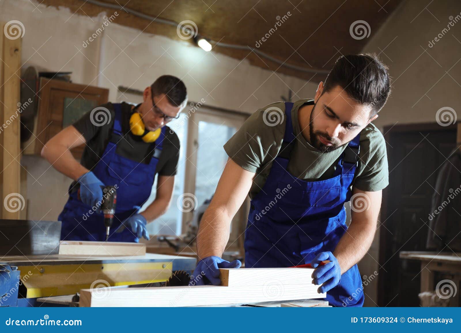 Professional Carpenters Working with Wood in Shop Stock Photo - Image ...