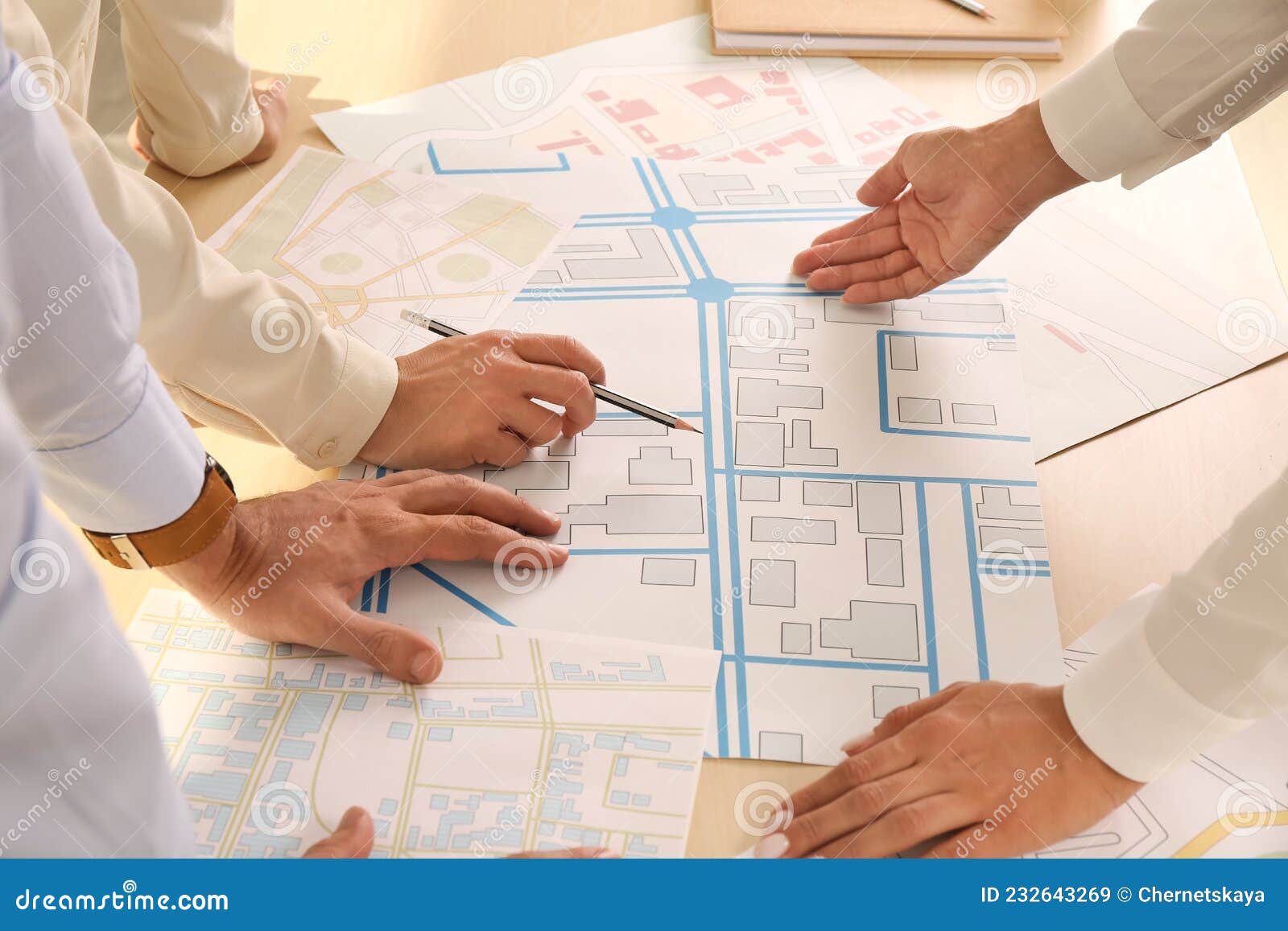 Professional Cartographers Working with Cadastral Map at Table, Closeup ...