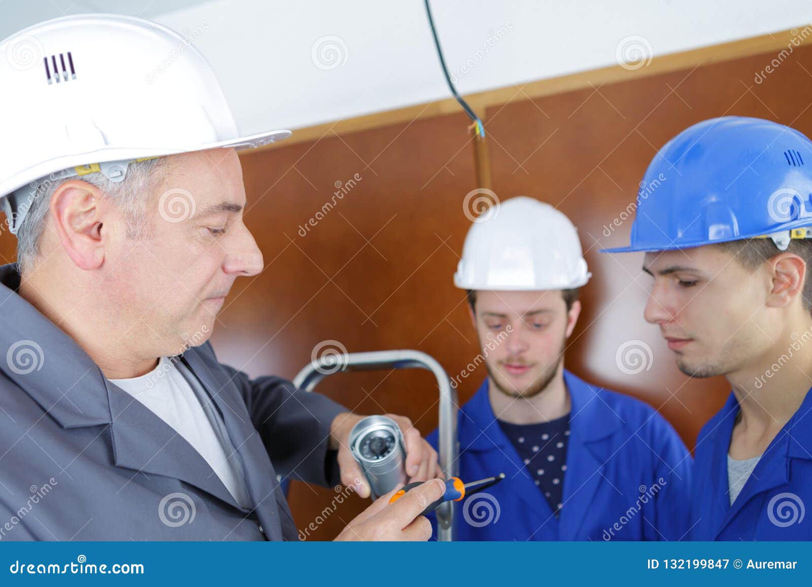 Professional Cctv Technician Working with Apprentices Stock Image ...