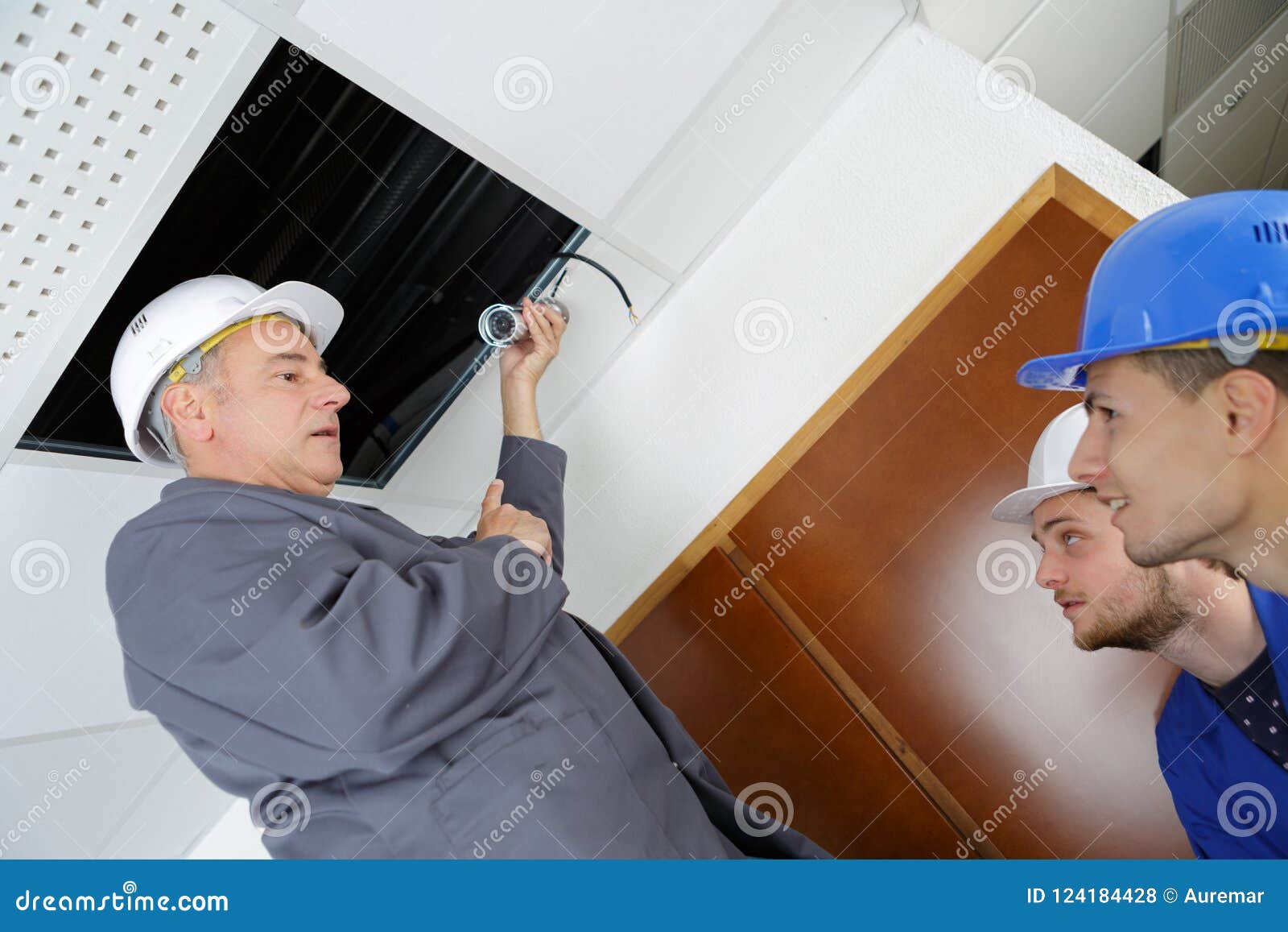 Professional Cctv Technician Working with Apprentices Stock Photo ...