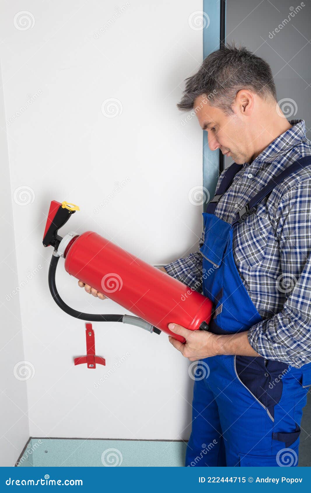 Professional Checking a Fire Extinguisher Stock Image - Image of metal ...