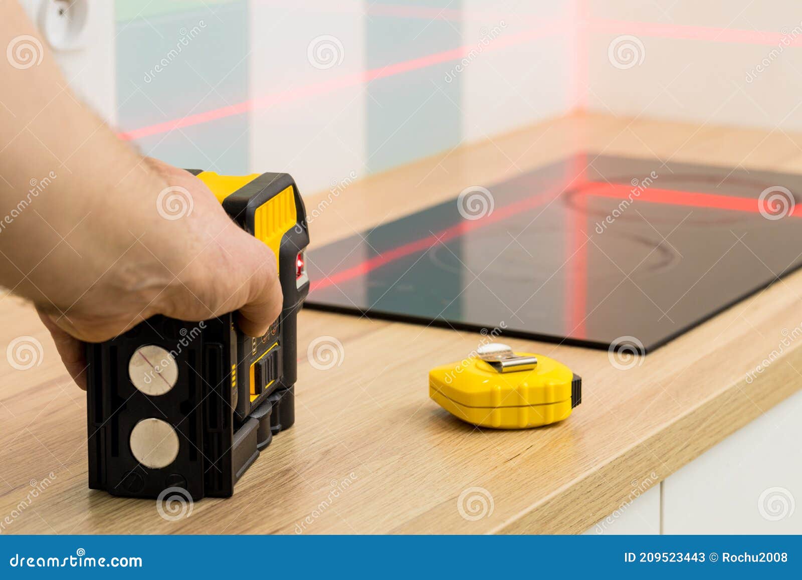A Professional Checks the Angles while Taking Measurements of the ...