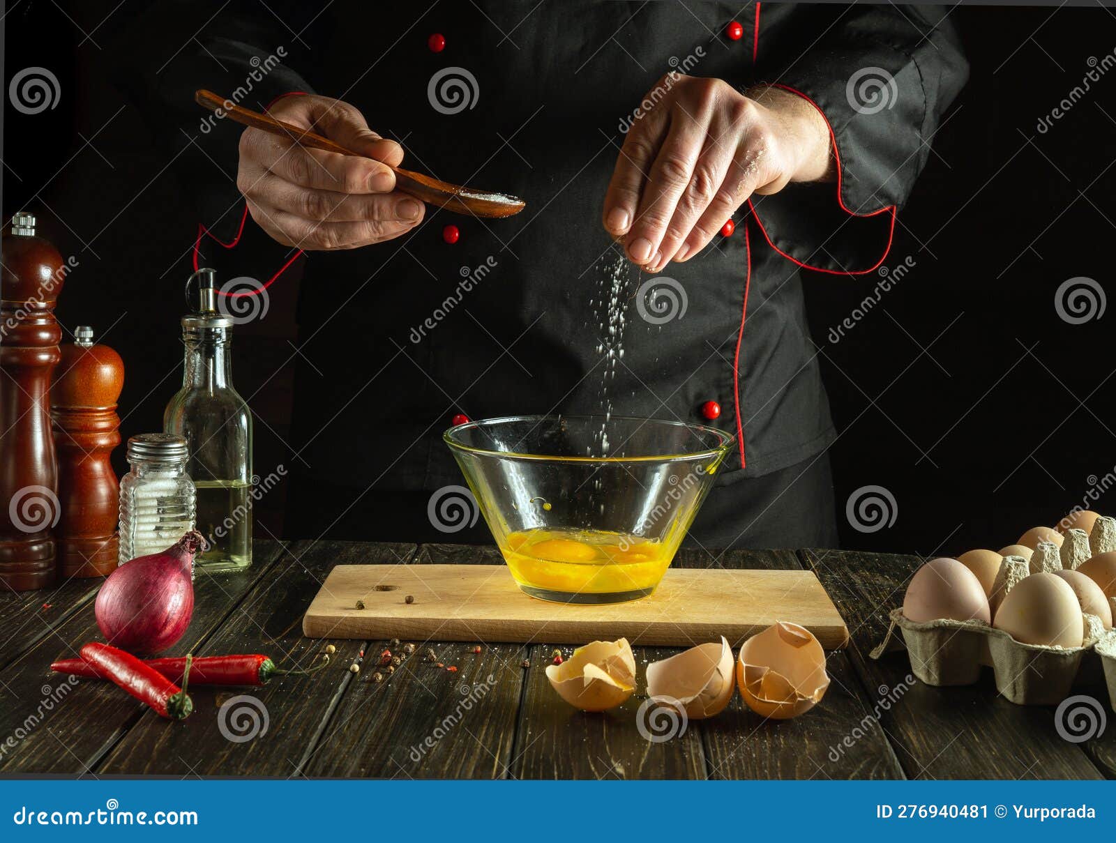 Professional Chef Adds Salt while Cooking the Eggs. Work Environment on ...